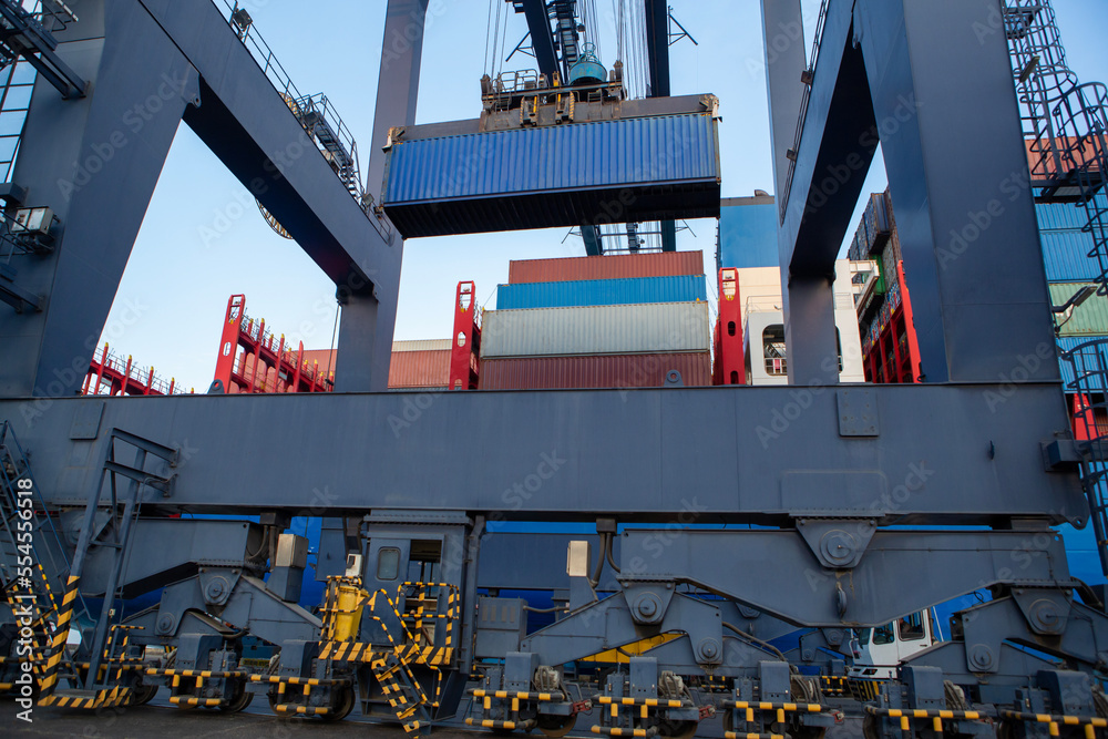Container port with container ship. berthing crane loads container onto ...