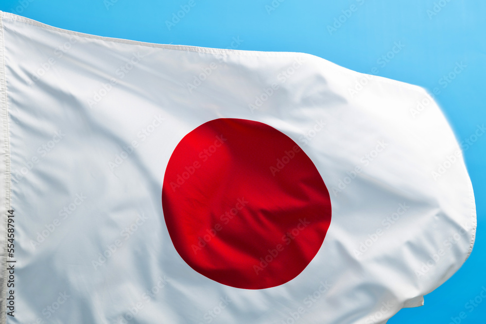 Japan flag waving on blue background Stock Photo | Adobe Stock