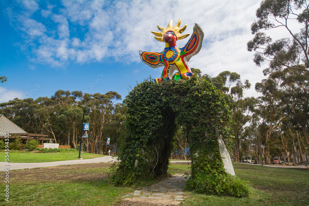 Sun God statue, a sculpture of colourful bird by Niki de Saint Phalle ...