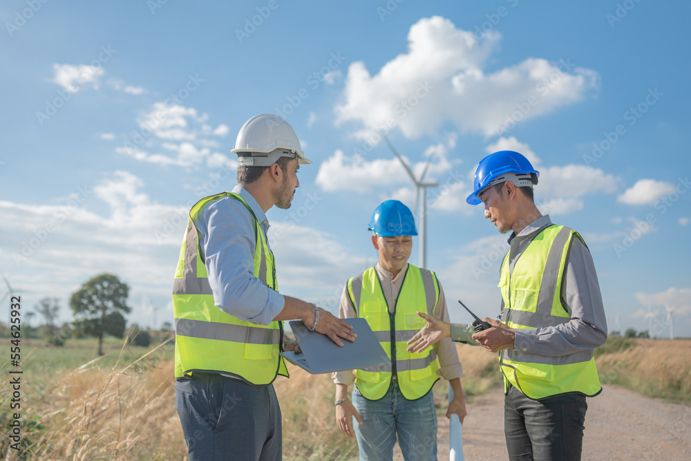 Asian engineers working in fieldwork outdoor. Workers walking and ...