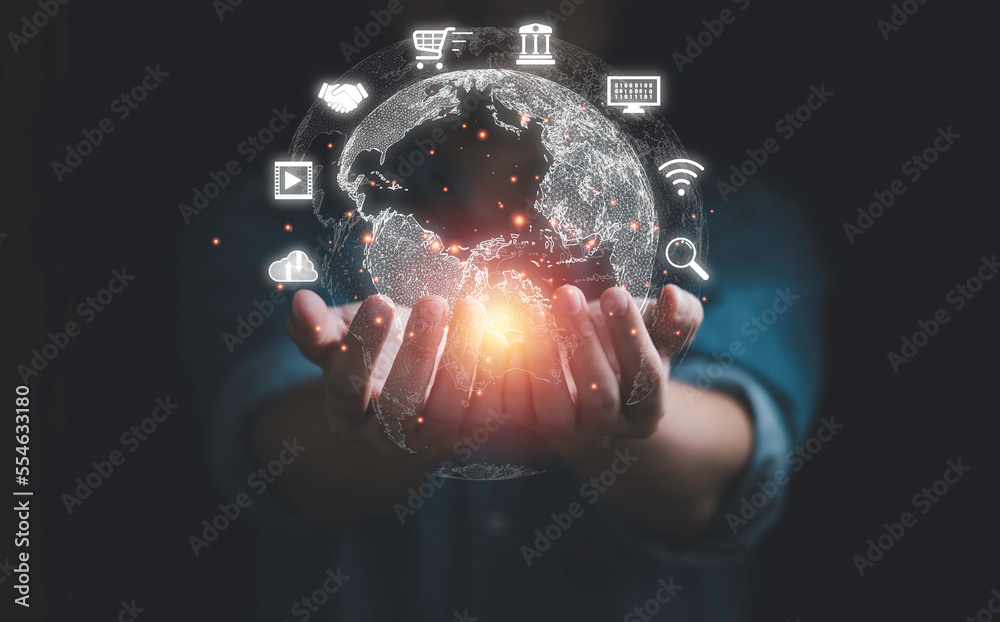 Businessman holding virtual world with icons for global data ...