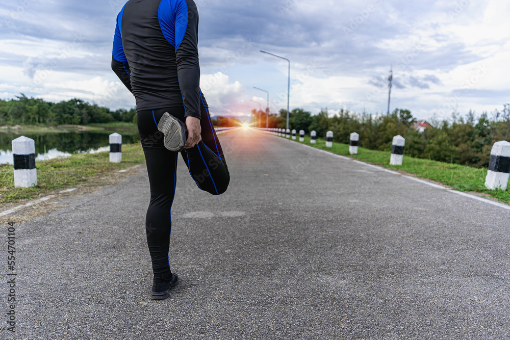 Male runner prepares to run on the road to ambition. Start over with ...