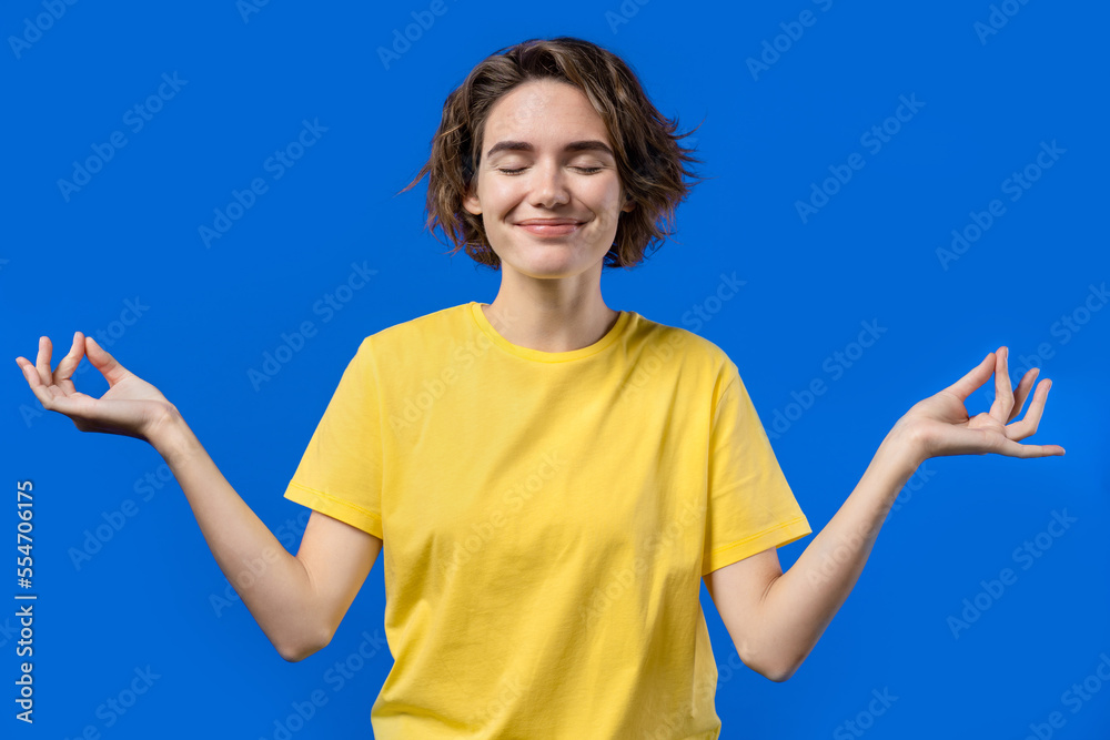 Calm woman relaxing, meditating, refuses stress. Sunny girl breathes ...