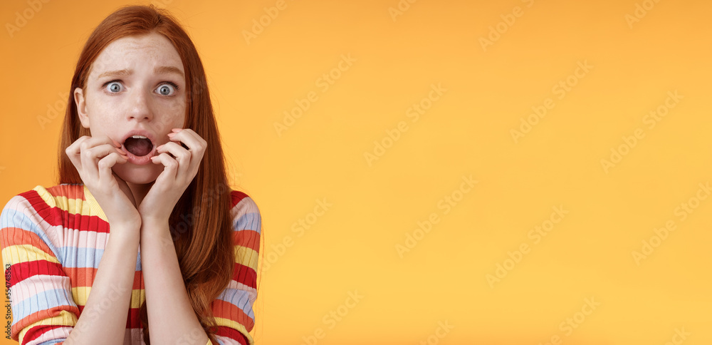 Timid insecure young ginger girl blue eyes feeling scared gasping ...