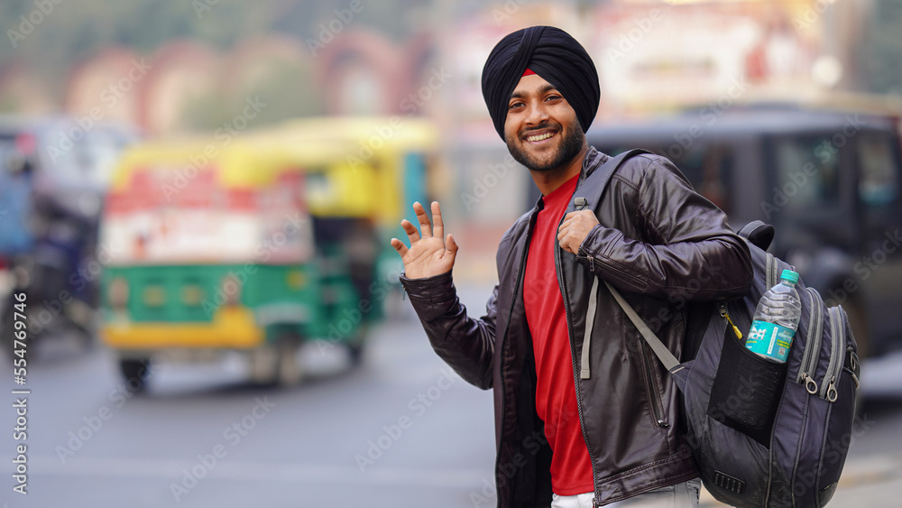 Saying hi Young Sikh man carrying a bag and going college Stock Photo ...