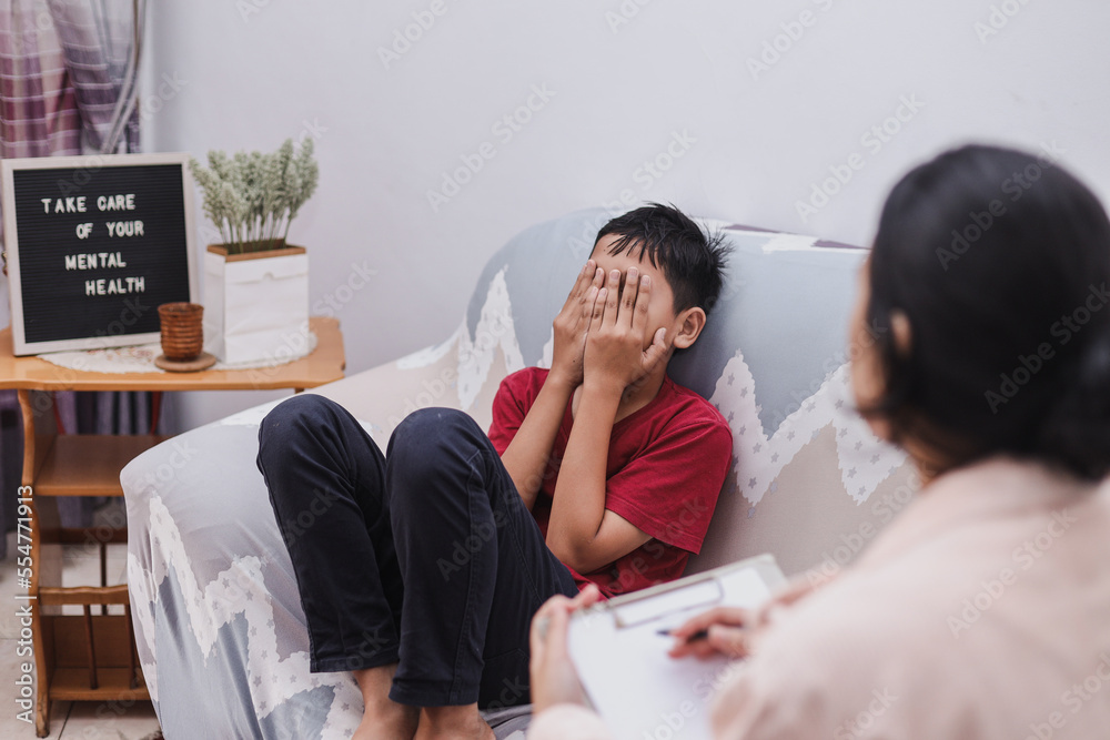 Children need help. Bullied little schoolboy crying in psychologist's ...