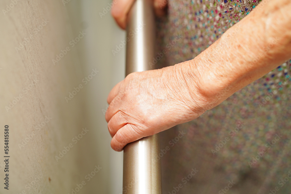 Asian elderly old woman patient use support rail on ramp, handrail ...