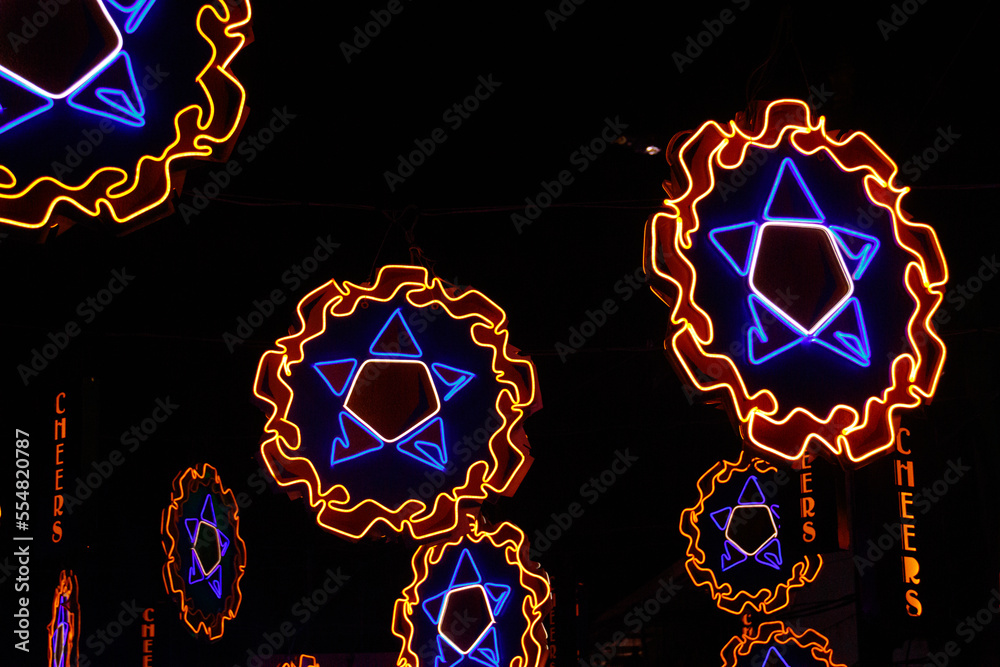 Neon lights shaped into traditional parol, a Filipino ornamental ...
