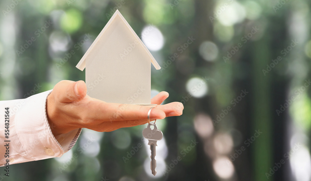 Real estate agent handing over house keys in hand Stock Photo | Adobe Stock