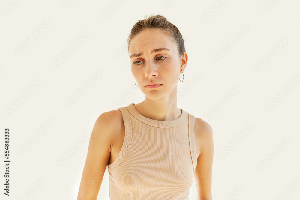 Depressed sad female looking aside with sad facial expression, being ...