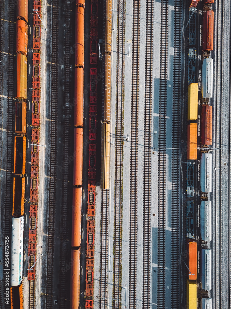 Birds eye view, vertical photo directly above cargo trains parked at ...