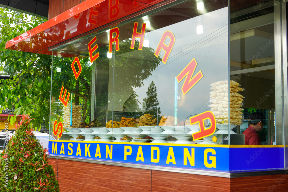 Semarang, Indonesia - March, 2023 : A traditional Padang restaurant in front with a glass ...