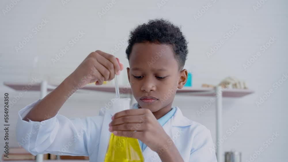 4K, school kid boy, studying science, used squeeze tube squeeze water ...