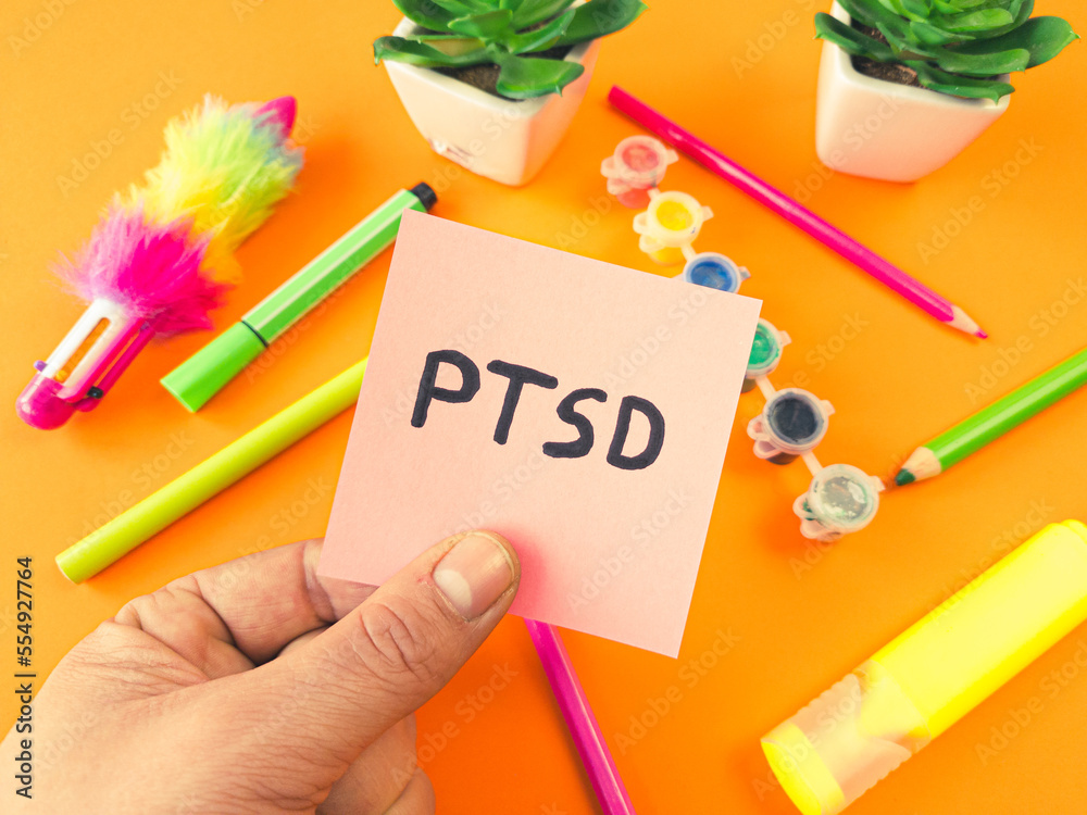 PTSD acronym Post Traumatic Stress Disorder handwritten on sticky note ...