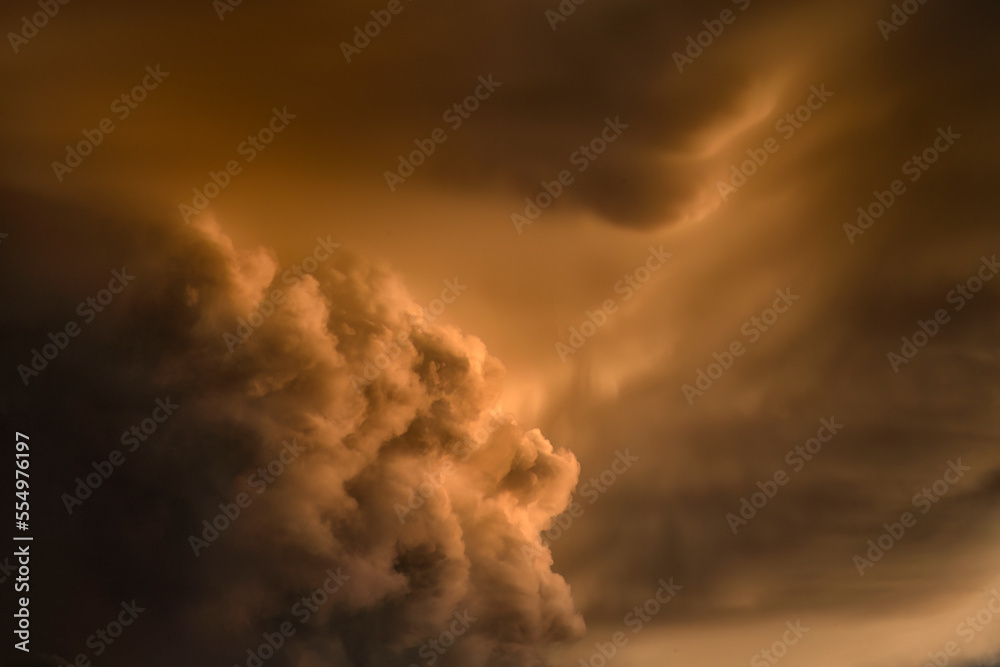 Glowing large supercell thunderheads form over the northern plains ...