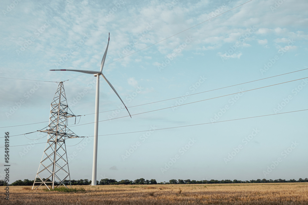 Ecofriendly wind turbine produces clean energy. Windmill generates ...
