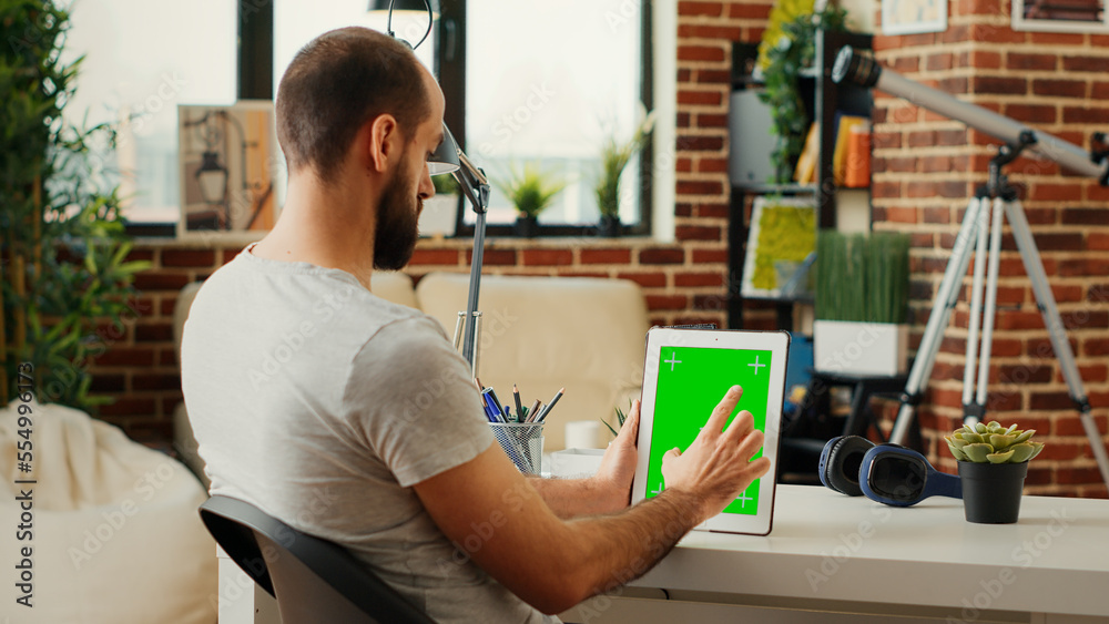 Office worker working with isolated greenscreen display on wireless ...
