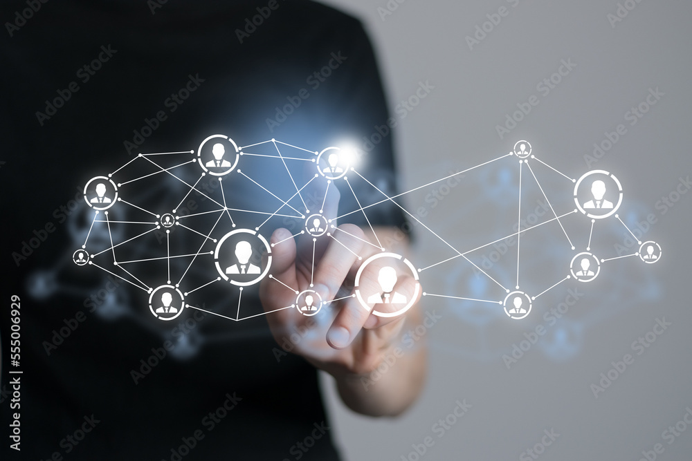 Human resources manager pointing at virtual network chain with person ...