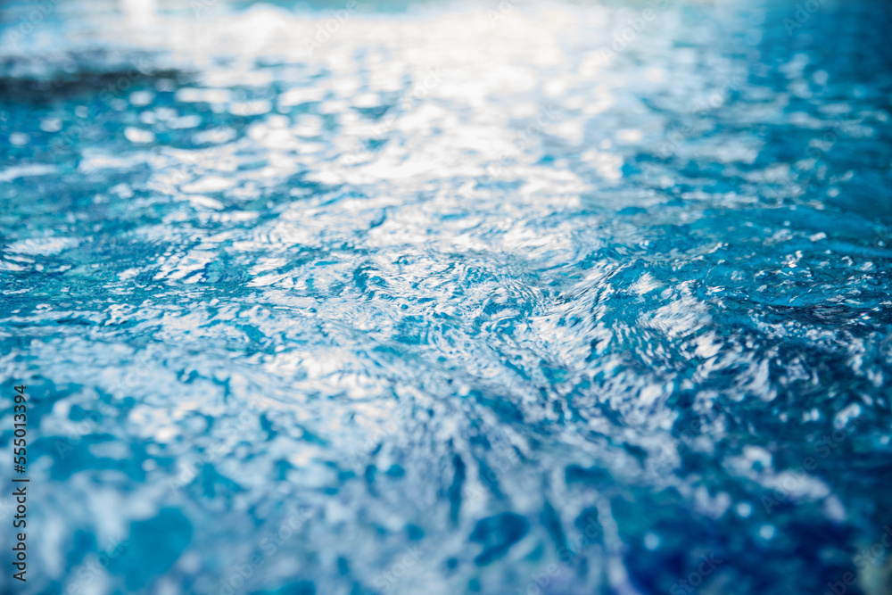 The beautiful pattern of blue water reflects the sun.Water background ...
