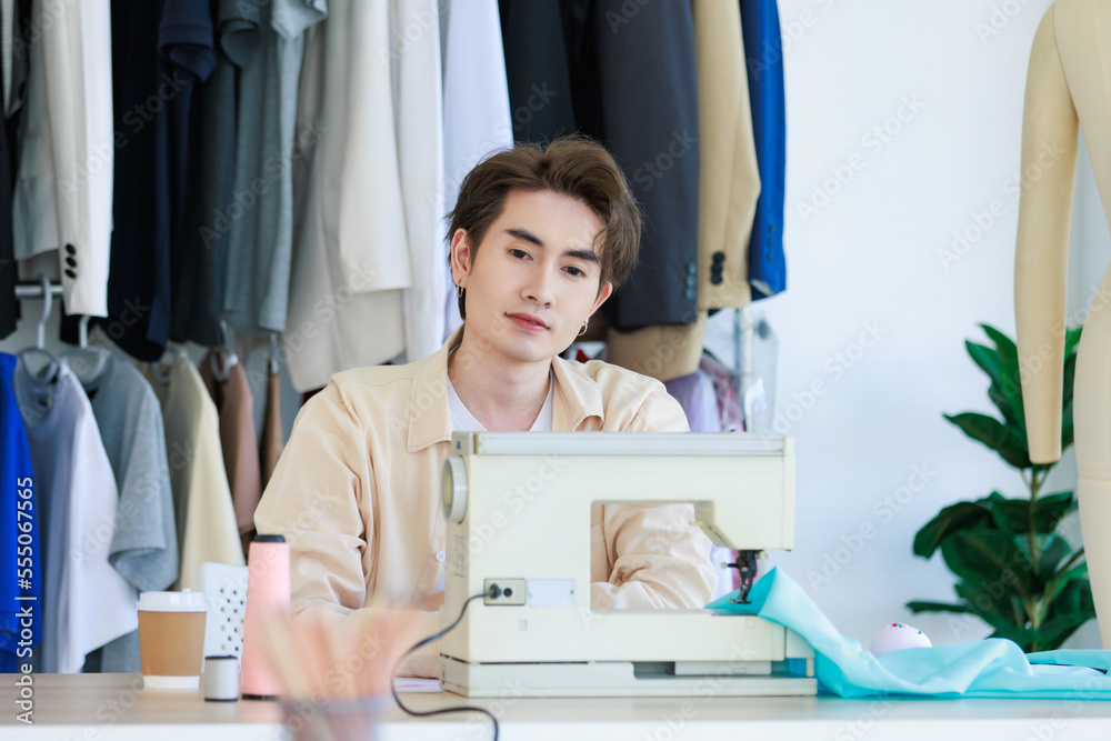 Millennial Asian young talent professional male dressmaker designer ...