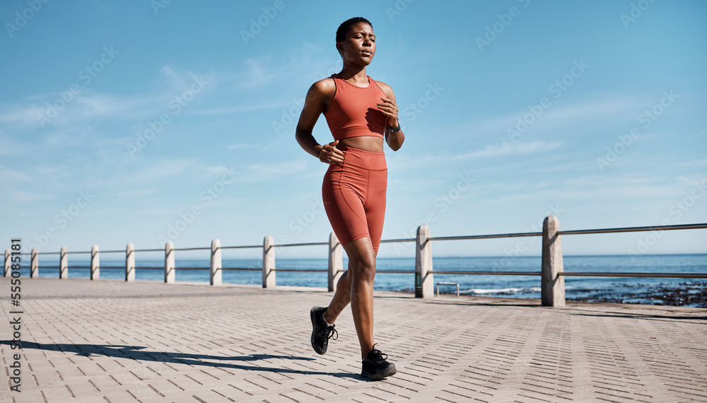 Run, black woman and beach for workout, exercise and training for ...