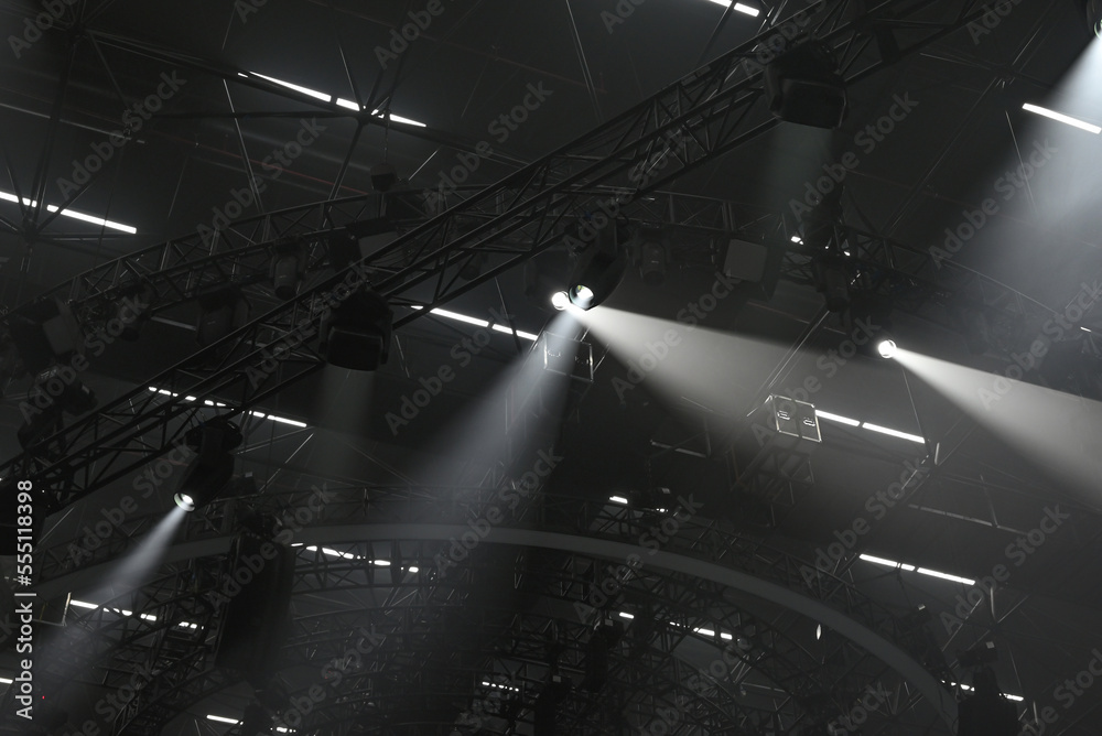 Moving head light on black background with light trusses Stock Photo ...