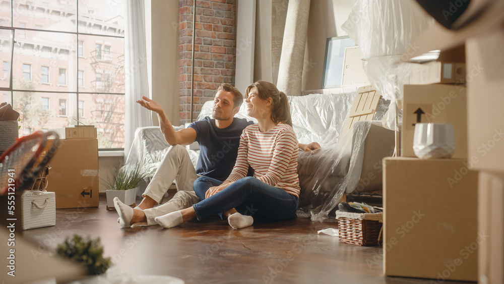 Moving In: Happy Couple Talk, Sitting on a Living Room floor of their ...