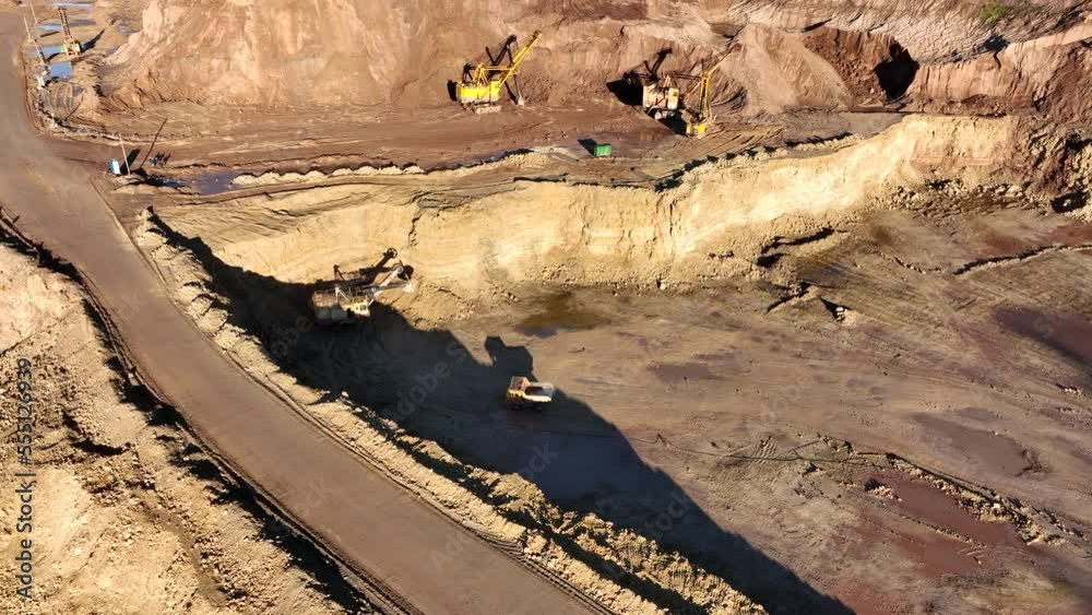 Excavator load dolomite rock in haul truck in open pit mining. Mining ...
