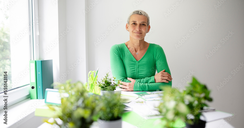 Landscape architect, garden architect is sitting in her modern green ...