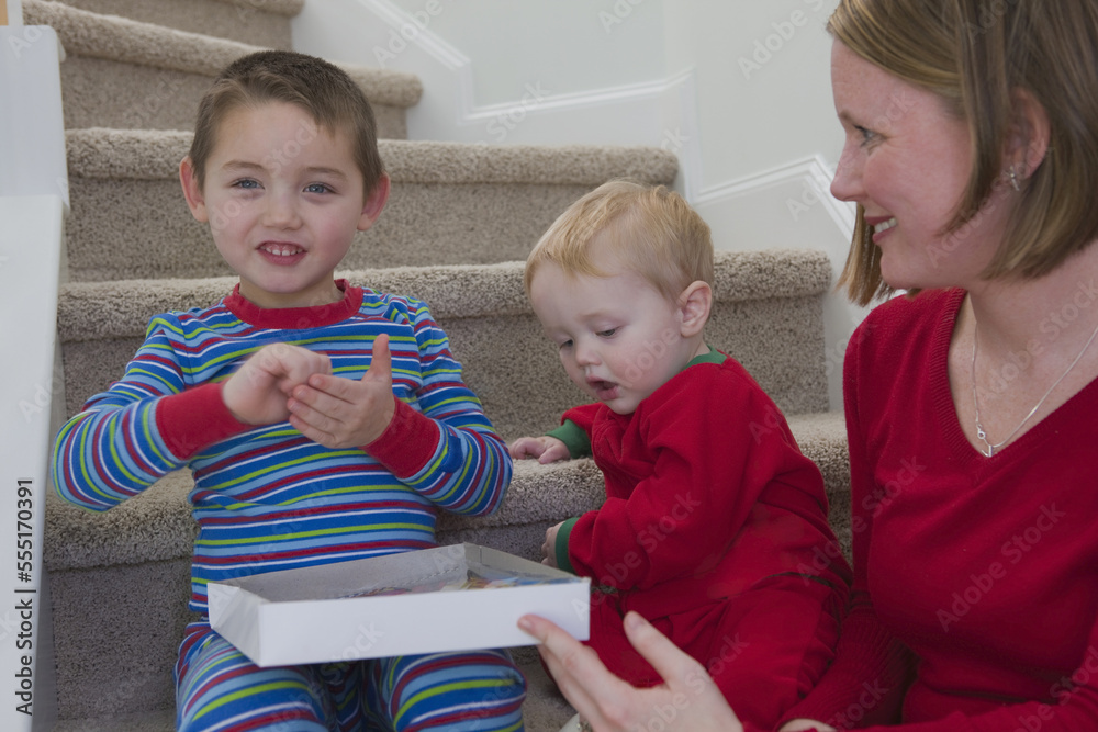 Boy signing the word 'Write' in American Sign Language sitting with his ...