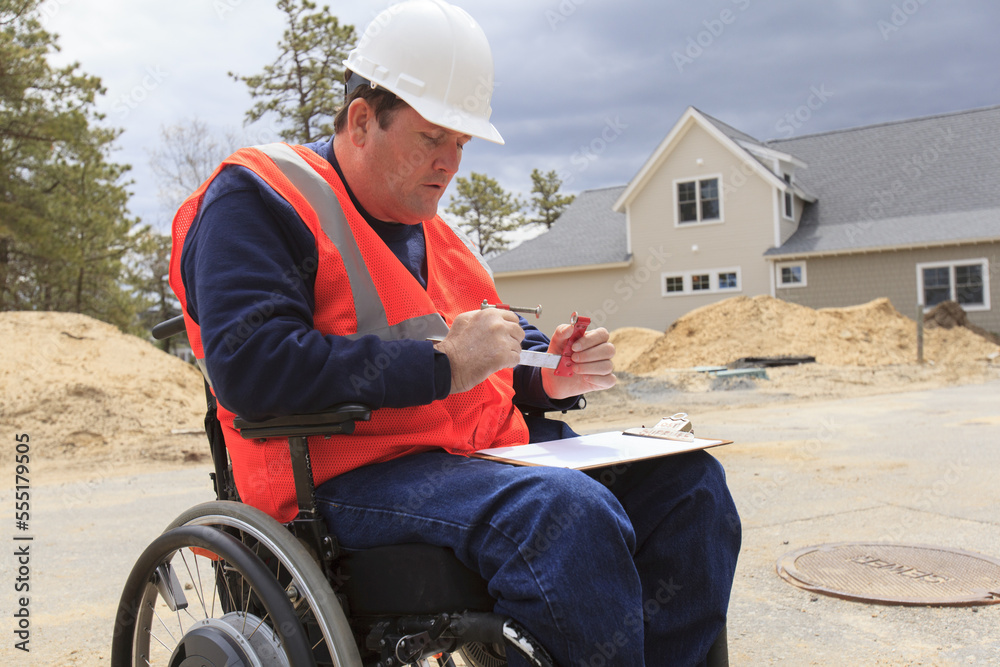 Construction engineer with spinal cord injury adjusting vise tool on ...