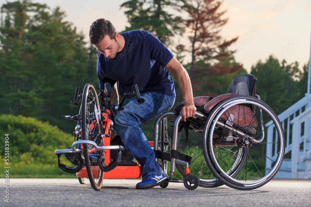 Man with spinal cord injury in his wheelchair getting on his custom ...