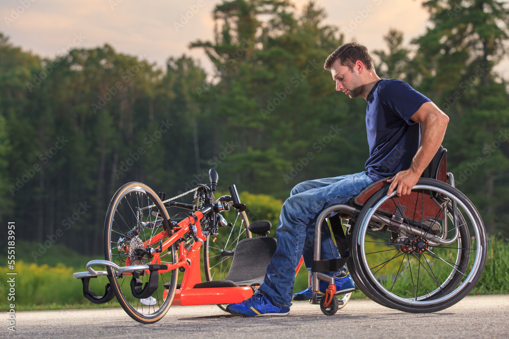 Man with spinal cord injury in his custom adaptive hand cycle getting ...
