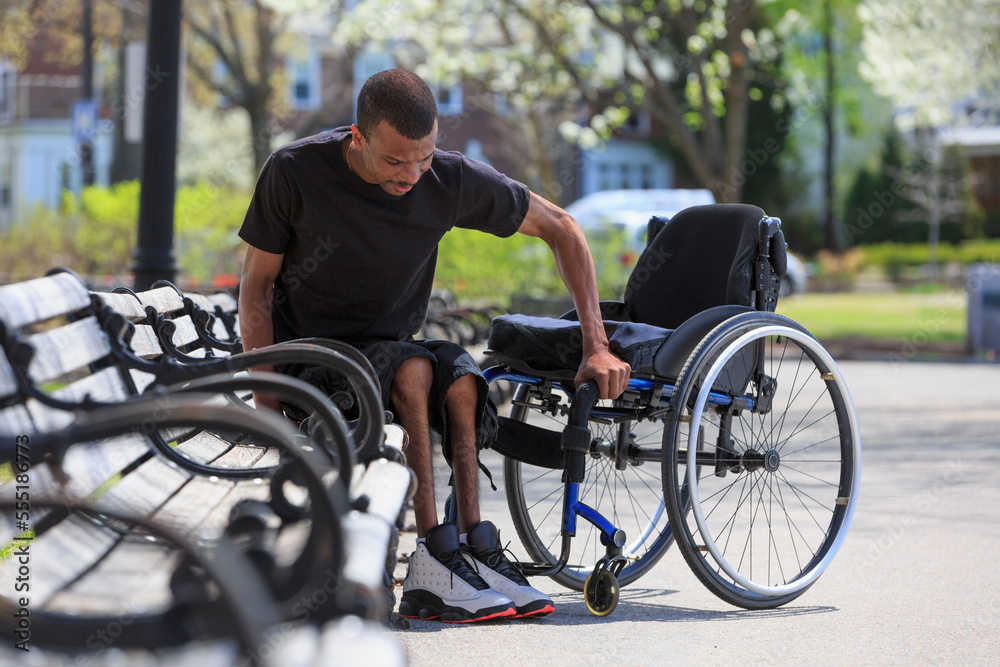 Man who had Spinal Meningitis getting out of a park bench and into his ...