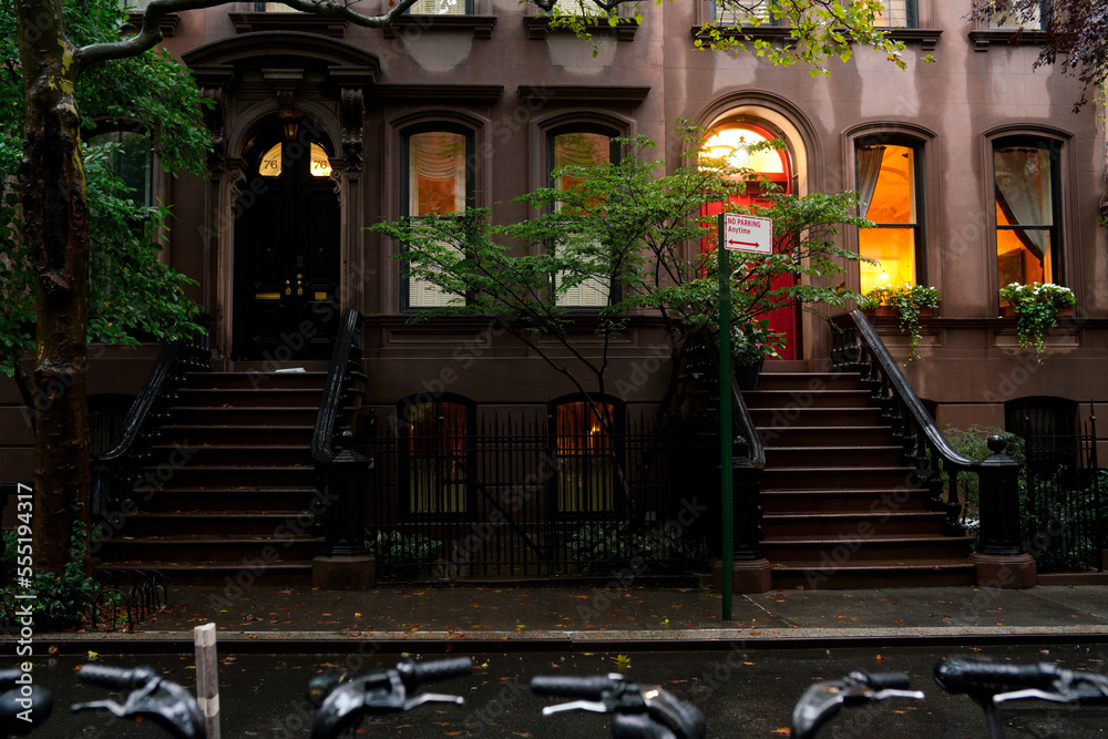 Brownstone house in New York. Typical exterior steps and doors on ...