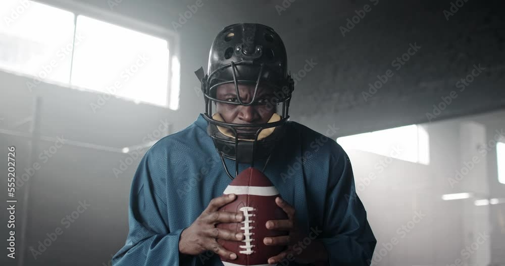 Portrait of strong aggressive African-American man rugby athlete ...