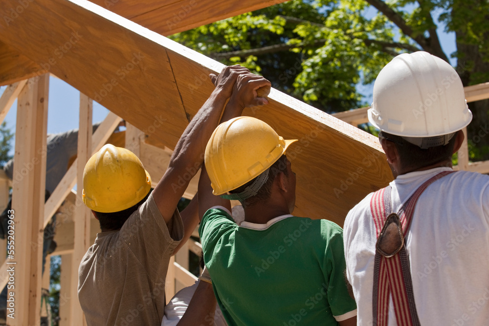 Carpenters lifting beam Stock Photo | Adobe Stock