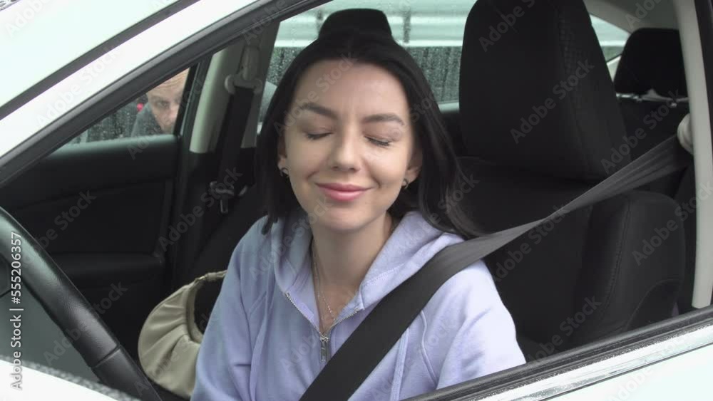 Safety for Women Driving Alone, crime on the road. A woman driver is ...