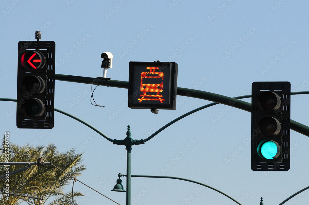 Traffic signal pole at street intersection displaying red light arrow ...