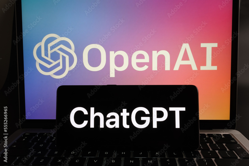 ChatGPT logo seen on smartphone and laptop display with blurred OpenAI ...