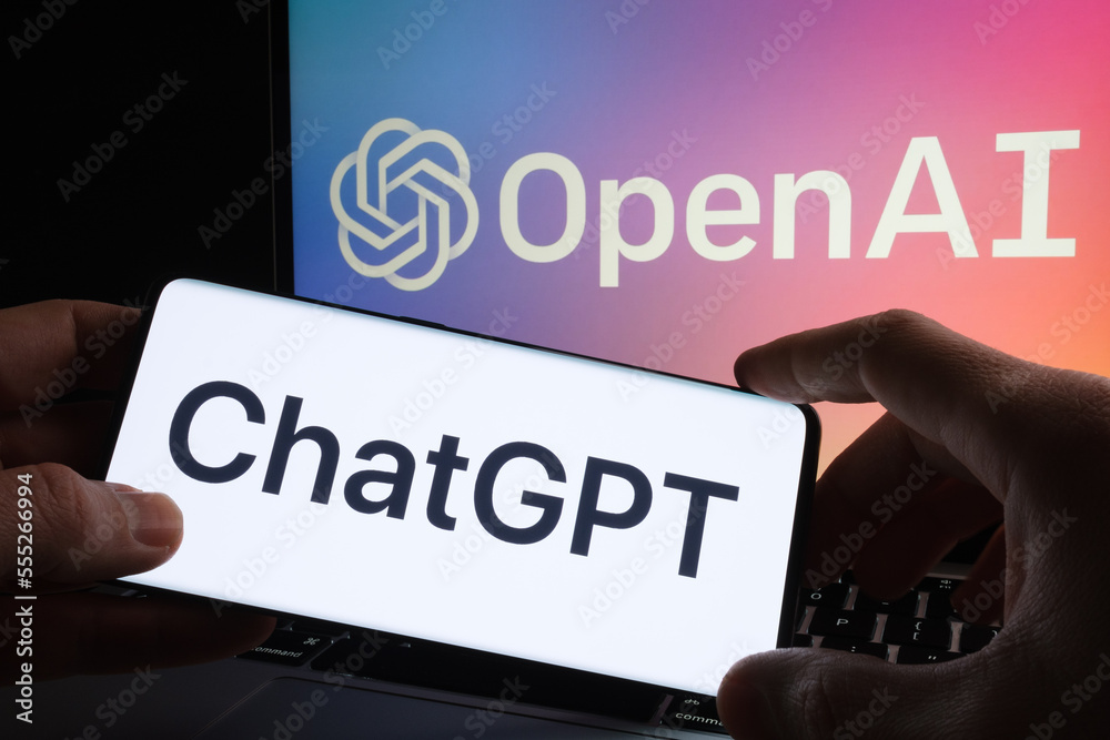 ChatGPT logo seen on smartphone and laptop display with blurred OpenAI ...