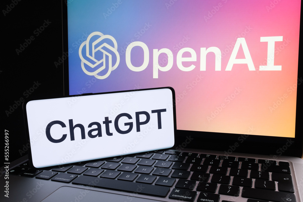 ChatGPT logo seen on smartphone and laptop display with blurred OpenAI ...
