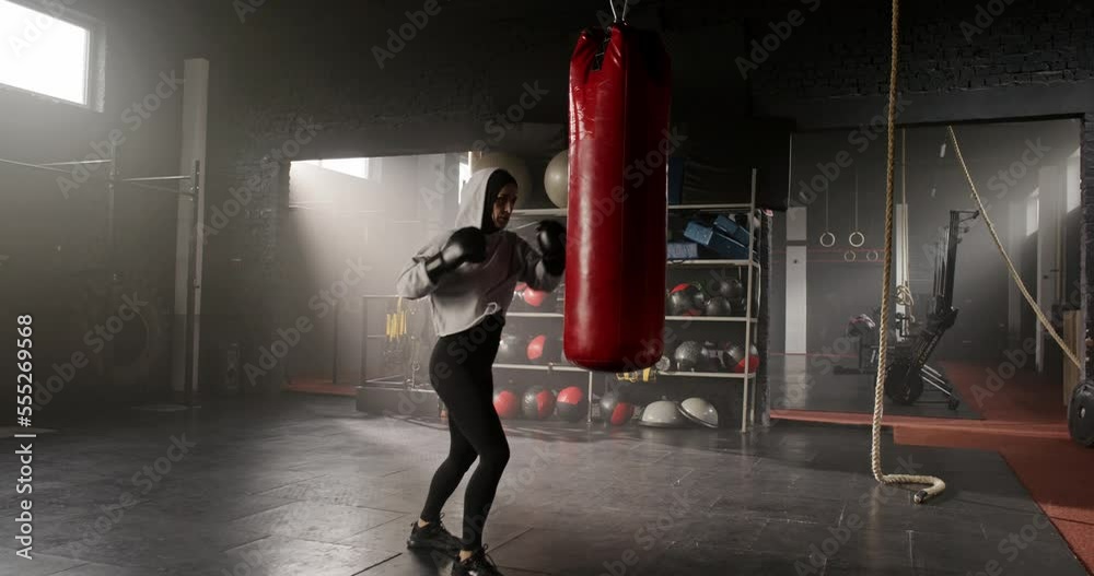 Vidéo Stock Beautiful fit young Arab female boxing fighter working out ...