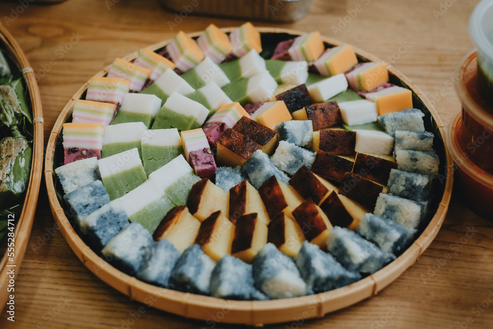 Traditional nyonya kuih on rattan basket tray. Cultural food ...