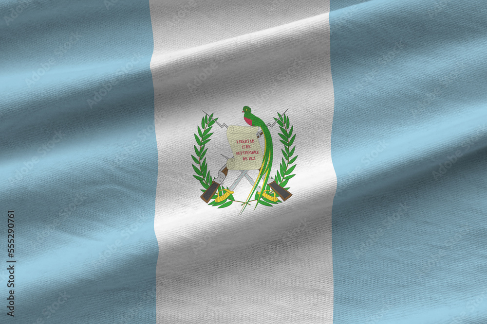 Guatemala flag with big folds waving close up under the studio light ...
