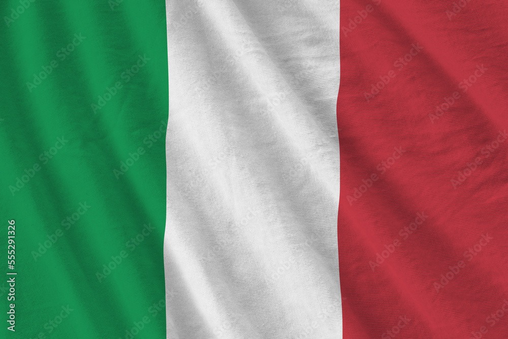 Italy flag with big folds waving close up under the studio light ...