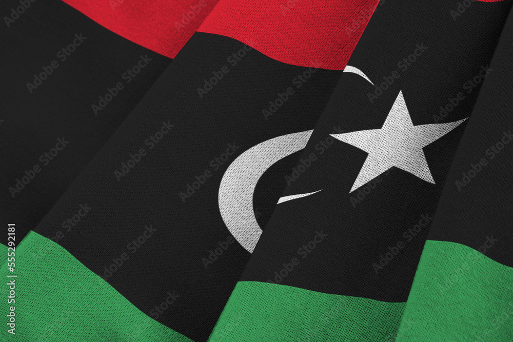 Foto de Libya flag with big folds waving close up under the studio ...