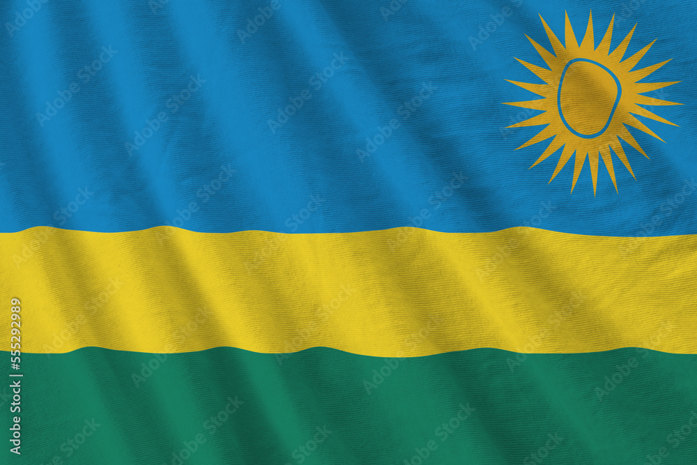 Rwanda flag with big folds waving close up under the studio light ...