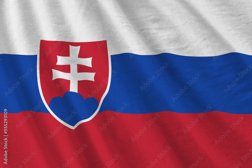Slovakia flag with big folds waving close up under the studio light ...