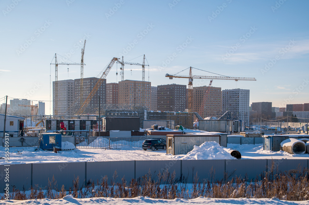 Next to the construction site there is a construction town where ...